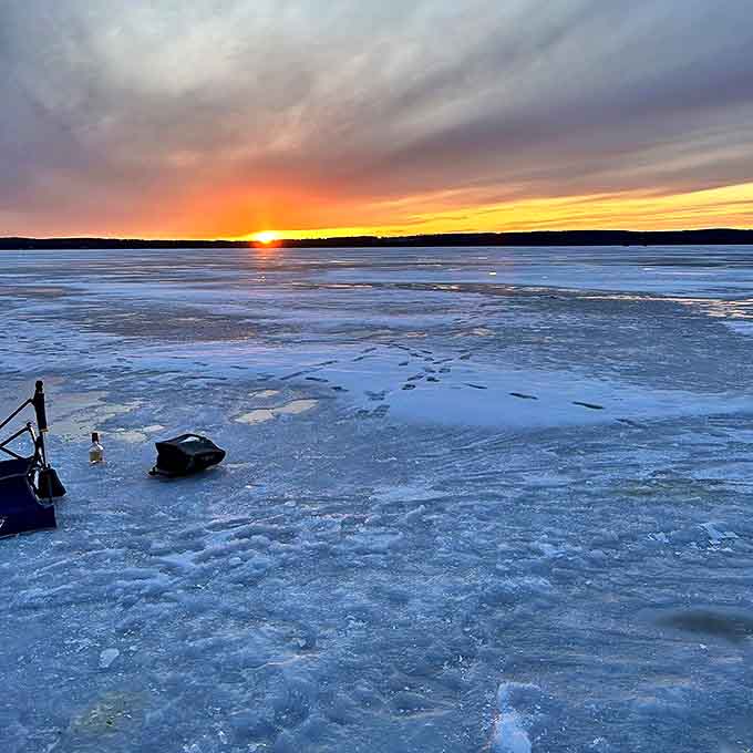 Fletcher's Landing sunset paints the frozen lake in golden hues, nature's artwork changing by the minute.
