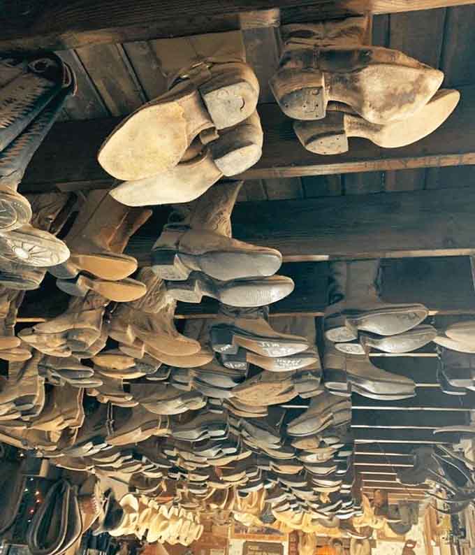 Shoe lasts hanging from the ceiling create an unexpected art installation, paying homage to the cobbler's craft while adding quirky character to this already eccentric space.