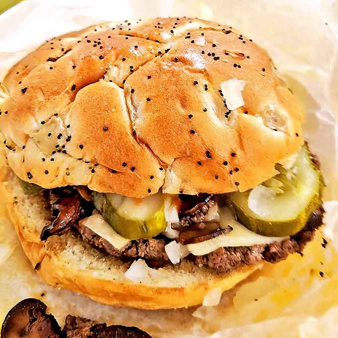 Sesame seeds add that perfect textural contrast to this beauty &ndash; where every ingredient plays its part in the symphony of flavors that is a Blimpy burger.