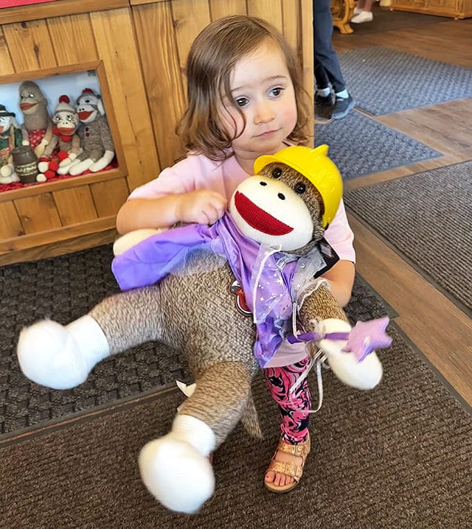 The joy on this child's face captures the magic of discovering sock monkeys &ndash; a tradition that continues to charm new generations.