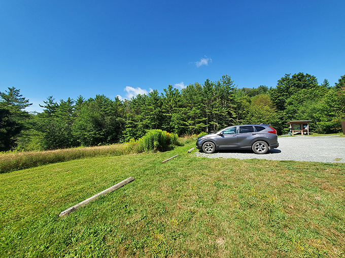 The humble parking area belies the extraordinary experiences waiting just beyond – Vermont's version of "don't judge a book by its cover."