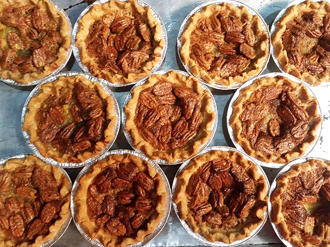 Homemade pecan pies lined up like sweet soldiers, each one promising the perfect finale to your meal.