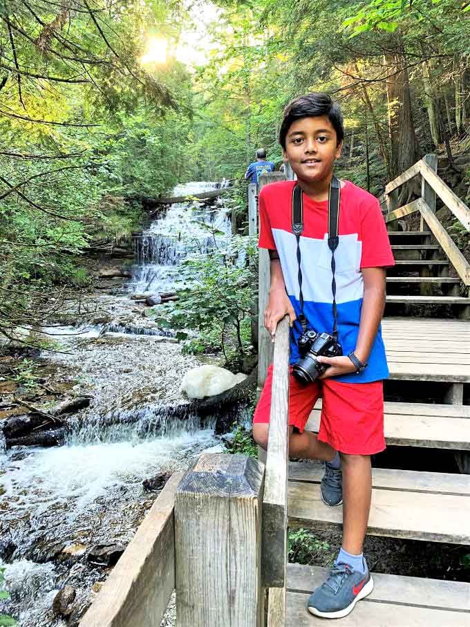 Young explorers discover the joy of connecting with nature, creating memories that will cascade through their lives like the falls themselves.