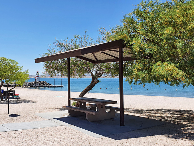 Shaded picnic perfection &ndash; this lakeside table has your name on it for alfresco dining with unbeatable views.
