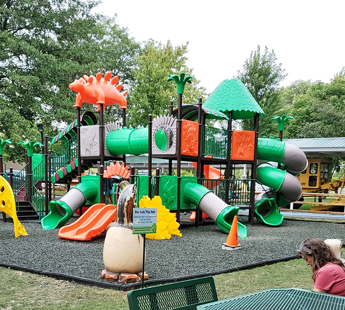 The playground where kids can burn off prehistoric energy while parents take a much-needed break on benches shaped like dinosaur footprints.