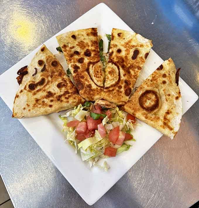 Quesadillas crisp enough to shatter with each bite, yet sturdy enough to hold their treasure of melted cheese and fillings.