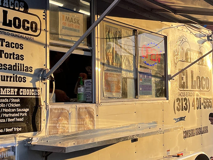Where dreams come true: The service window glows with promise as the "OPEN" sign beckons hungry taco seekers.