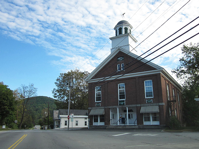 Under a perfect blue sky, Chester's town hall stands, welcoming visitors down the wide street lined with trees.