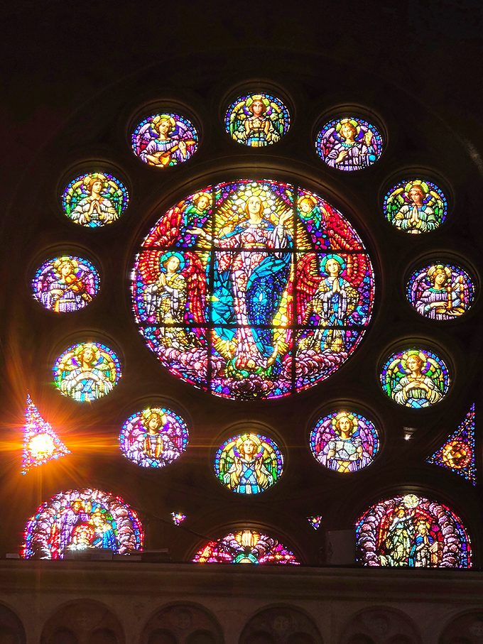 Stained glass masterpieces filter sunlight into kaleidoscopic patterns, their vibrant colors telling ancient stories in beams of jewel-toned light.