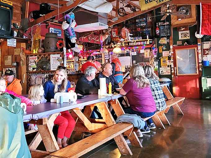 Picnic tables filled with happy diners create the kind of communal atmosphere where strangers become friends over shared fish baskets.
