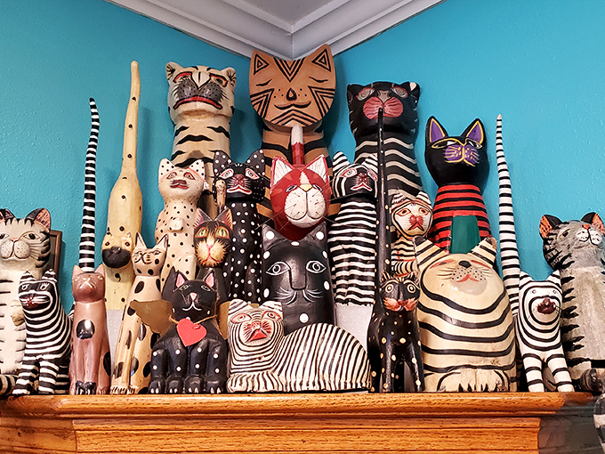 Wooden, ceramic, and painted cats of all shapes and sizes create a whiskered wonderland for feline figurine enthusiasts.
