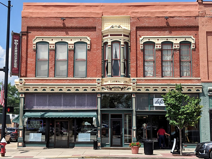 Step into a time machine! Kissner's brick facade whispers tales of bygone eras, while its ornate bay window winks at passersby, promising delicious secrets within.