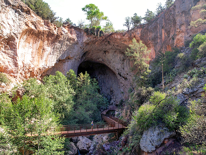 Nature's grand entrance: A metal walkway invites adventurers into the heart of Tonto's geological wonder. Indiana Jones, eat your heart out! 