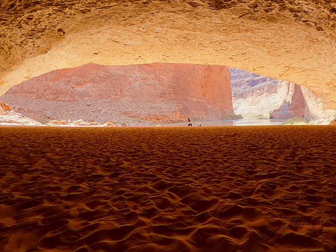 Nature's perfect frame! Redwall Cavern's massive opening reveals the Colorado River beyond, like a living postcard where time stands perfectly still.