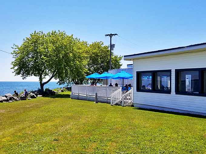 Waterfront bliss! Augie's white exterior might be modest, but that deck overlooking Lake Huron promises breakfast with a side of paradise.