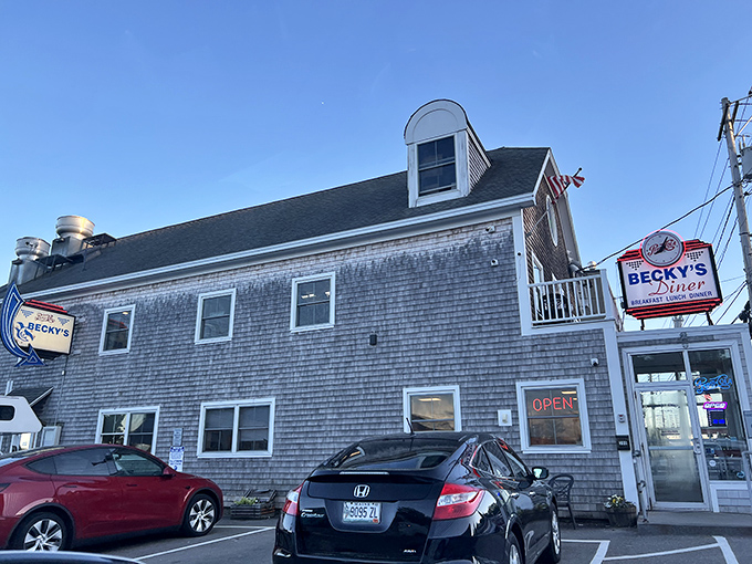 Classic coastal charm: Becky's weathered shingle exterior stands proudly on Hobson's Wharf, a beacon for hungry travelers and locals alike.