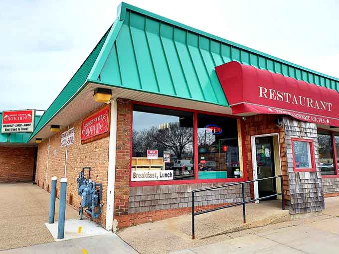 That cheerful red awning and teal roof might look modest, but inside awaits breakfast glory of legendary proportions.