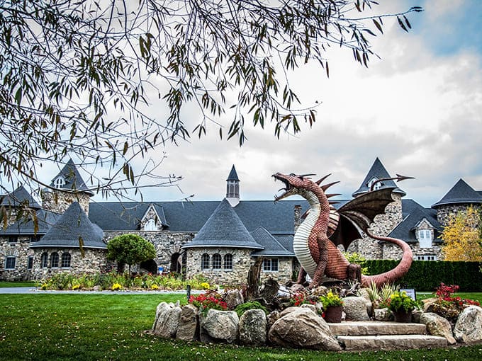 Castle Farms: Where medieval dreams meet Michigan reality, complete with a fire-breathing dragon standing sentinel over stone turrets and manicured gardens.