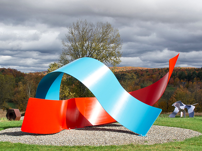 A vibrant dance of color and form &ndash; this ribbon-like sculpture twists against Vermont's autumn landscape like frozen music.