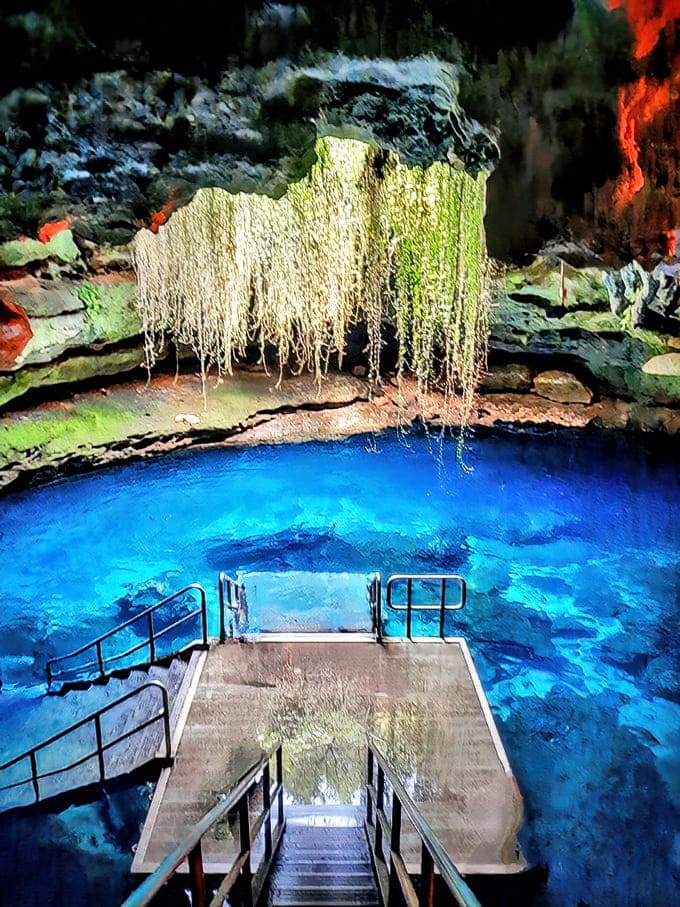 The ethereal blue glow of Devil's Den Prehistoric Spring creates an underwater cathedral effect that no filter could improve upon.