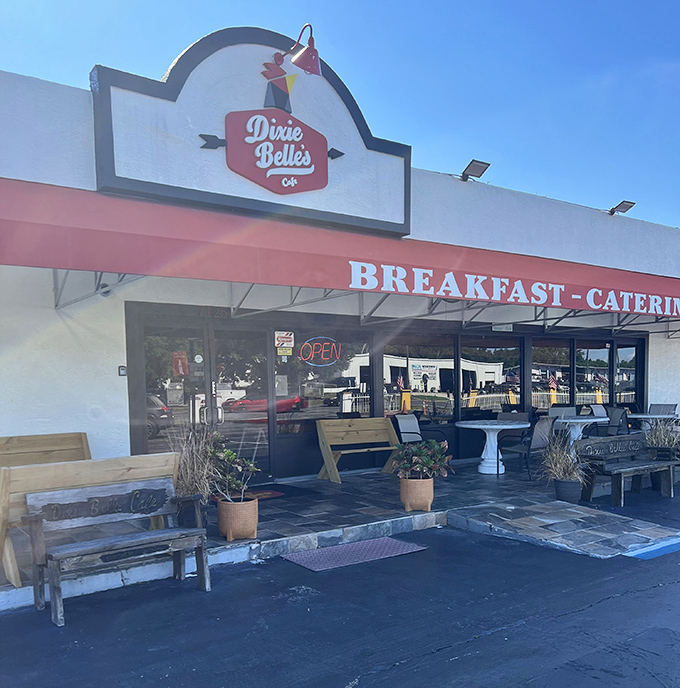 Dixie Belle's Cafe welcomes hungry visitors with its charming storefront, where Southern comfort begins before you even step through the door.