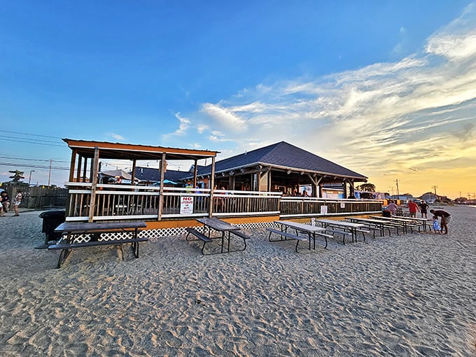 Sunset casts golden light on Dock's Beach House, where wooden decks meet sandy shores and Lake Erie's waves provide nature's soundtrack.