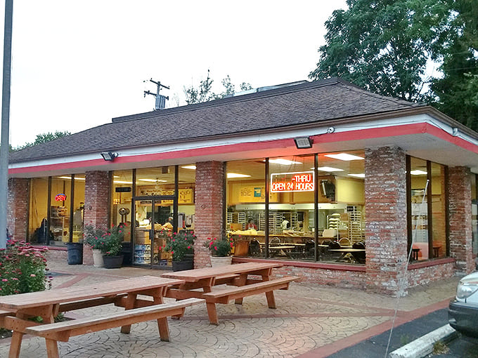 Exterior: The unassuming brick fortress of Dom Bakeries stands like a sugary sentinel on Michigan Avenue, its wooden benches ready for the inevitable morning pilgrimage.
