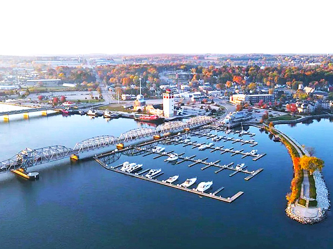Aerial view of Sturgeon Bay's marina &ndash; where boats dance in formation like a carefully choreographed water ballet beneath that iconic steel bridge.