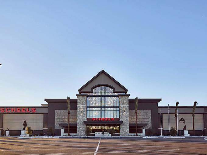 The impressive stone and glass fa&ccedil;ade of Scheels stands like a retail cathedral in Chandler, promising adventures beyond mere shopping.