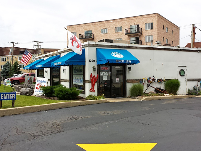A humble white building with bright blue awnings stands ready to serve, like that reliable friend who's always there when you need them.