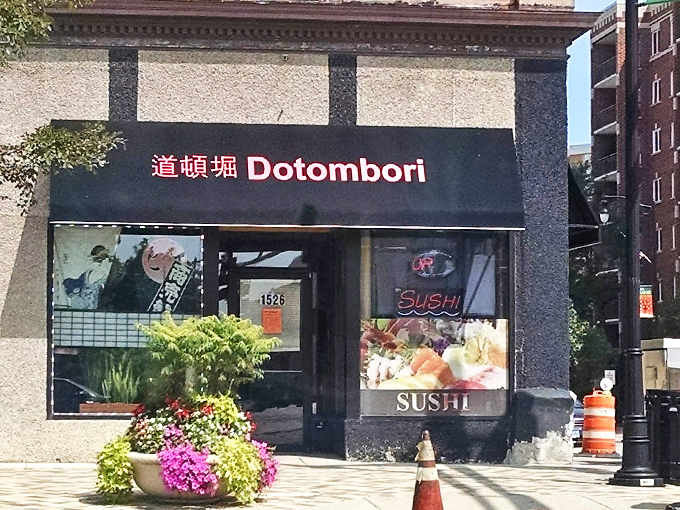 A welcoming storefront in Des Plaines, where traditional Japanese characters meet modern simplicity. Those pink flowers add just the right touch of charm