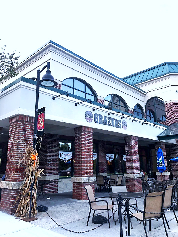 The bold signage of Grazers stands proudly against Vermont's sky, promising comfort food with modern flair in this welcoming Williston spot.