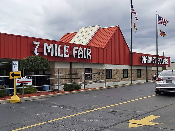 The iconic red-roofed entrance to Seven Mile Fair stands like a beacon for treasure hunters and bargain lovers across Wisconsin.