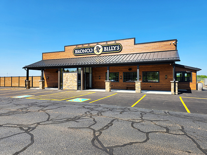 Rustic charm meets Midwestern hospitality at Bronco Billy's wooden exterior &ndash; your first clue that authentic flavors await inside.