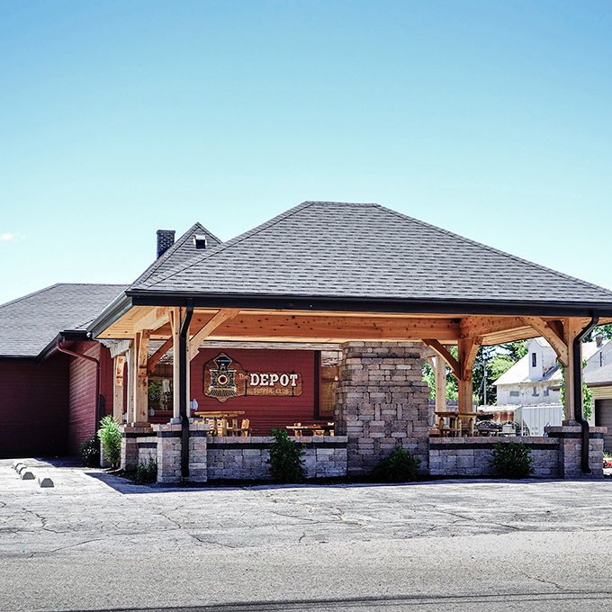 The iconic red exterior of PJ Campbell's at The Depot welcomes hungry travelers with historic charm and the promise of culinary delights within.