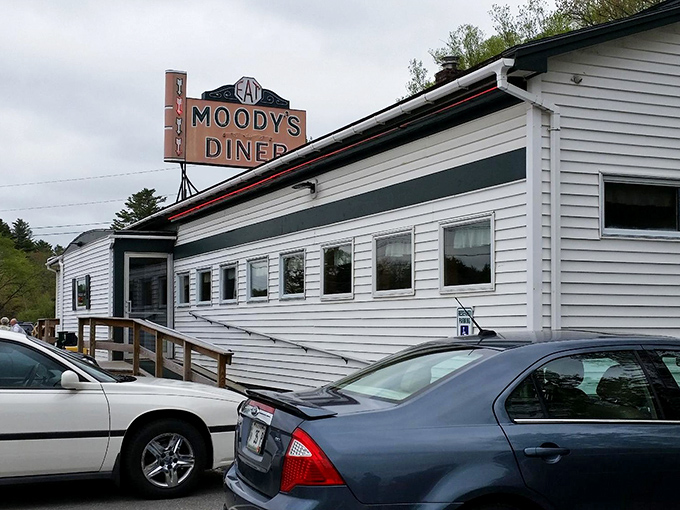 The exterior view shows the classic white clapboard building that houses this Maine treasure, an unassuming structure containing culinary magic.