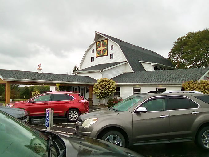 The iconic white barn exterior with its distinctive quilt emblem stands as a beacon for comfort food seekers traveling through Ottawa, Illinois.