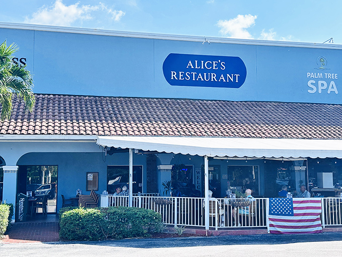Alice's Restaurant welcomes hungry visitors with its cheerful blue exterior and inviting patio &ndash; breakfast paradise found in Stuart, Florida!