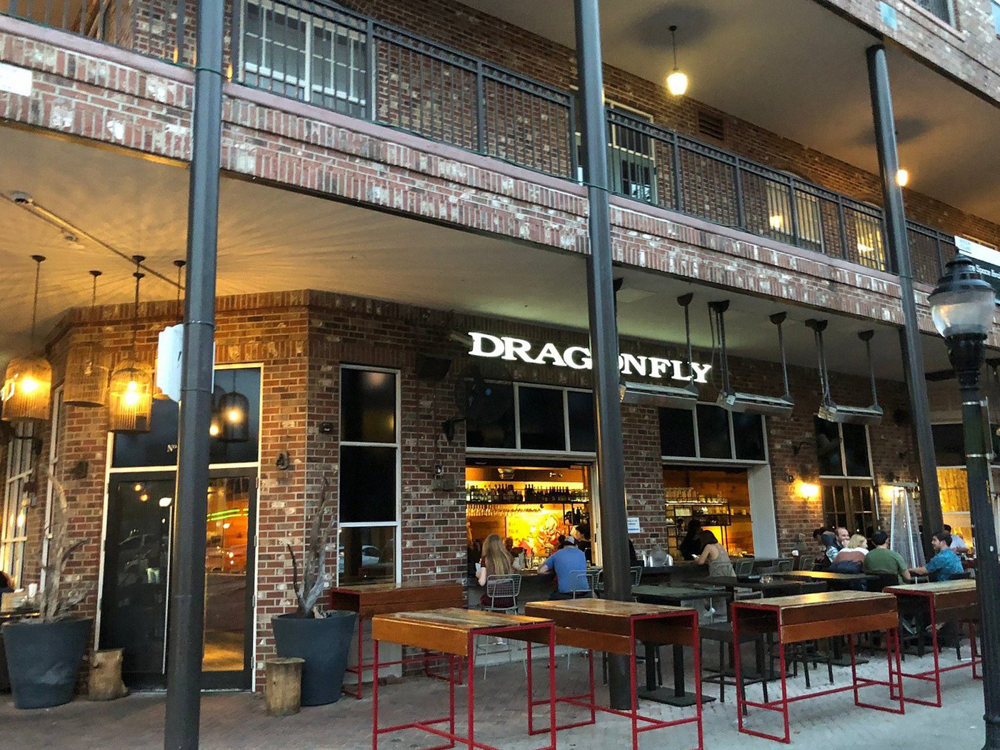 Dragonfly's inviting brick façade beckons food lovers with its warm glow and stylish outdoor seating – Gainesville's worst-kept culinary secret.