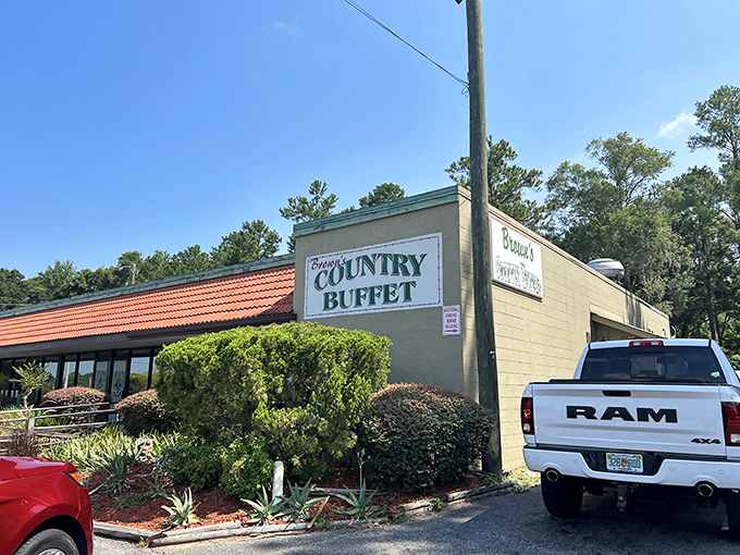 Brown's Country Buffet welcomes hungry travelers with its distinctive orange-tiled roof and unpretentious charm &ndash; a roadside beacon of Southern comfort.