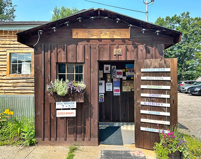 The rustic wooden exterior of Poorhouse Pies beckons with its charming "Pie fixes everything" sign &ndash; a humble promise this little shack delivers on spectacularly.