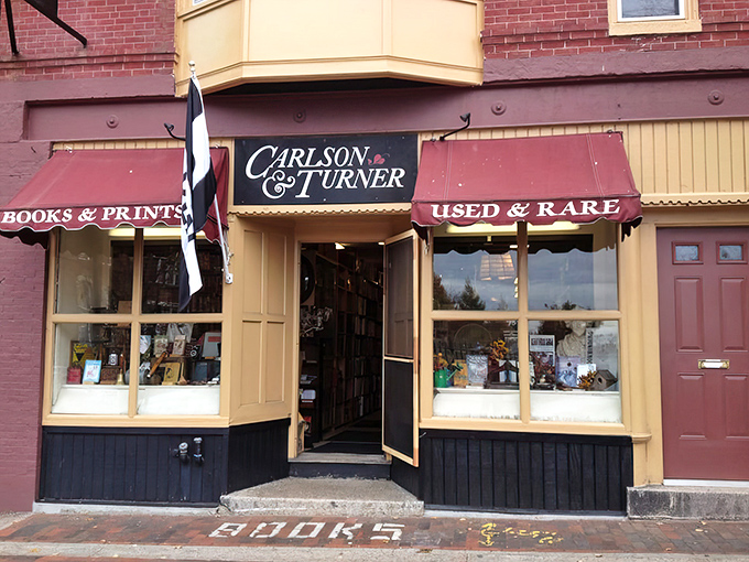 The burgundy fa&ccedil;ade of Carlson & Turner beckons bibliophiles with its classic awnings and promise of literary treasures within.