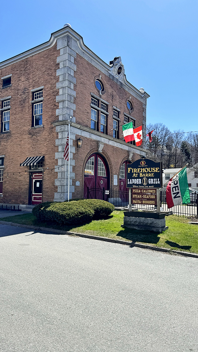 The historic brick fa&ccedil;ade of The Firehouse at Barre stands proudly on South Main Street, its distinctive red doors welcoming hungry visitors instead of fire trucks.