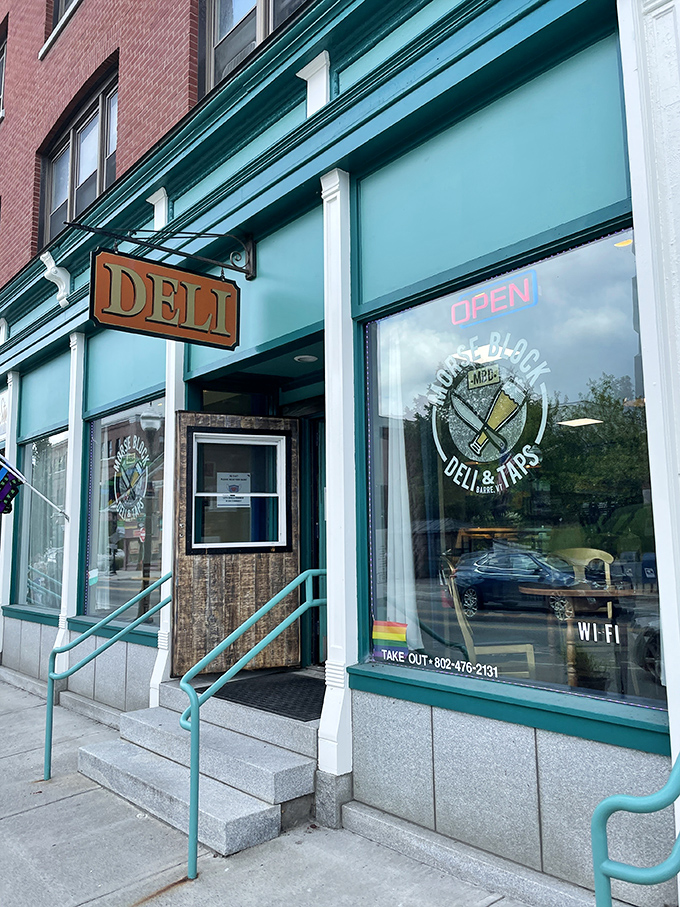 The turquoise facade of Morse Block Deli beckons with understated charm, its vintage "DELI" sign promising simple pleasures that belie the culinary treasures within.