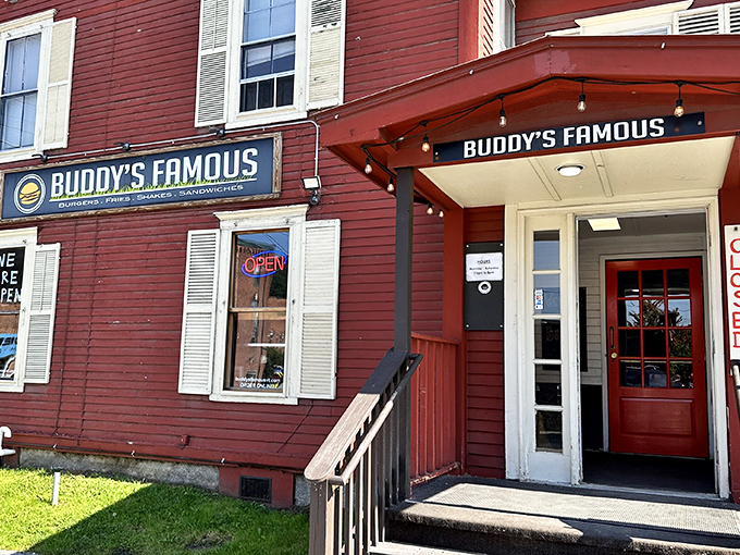 The iconic red exterior of Buddy's Famous stands as a beacon for milkshake pilgrims, its unassuming charm belying the culinary treasures within.