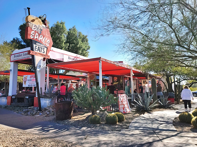 The iconic Big Earl's sign stands proud against the Arizona sky, promising "Greasy Eats" with a side of nostalgia and desert charm.