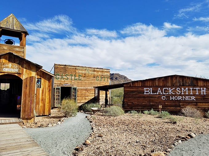 Weathered wooden facades of Castle Dome City stand defiant against time, with the church, general store, and blacksmith shop awaiting your discovery.