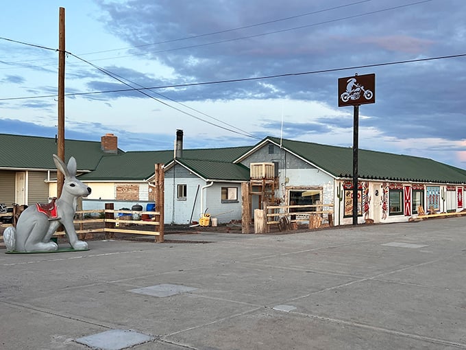 The unassuming exterior of the Jackrabbit Trading Post stands as a Route 66 landmark, complete with its signature giant rabbit statue welcoming weary travelers.