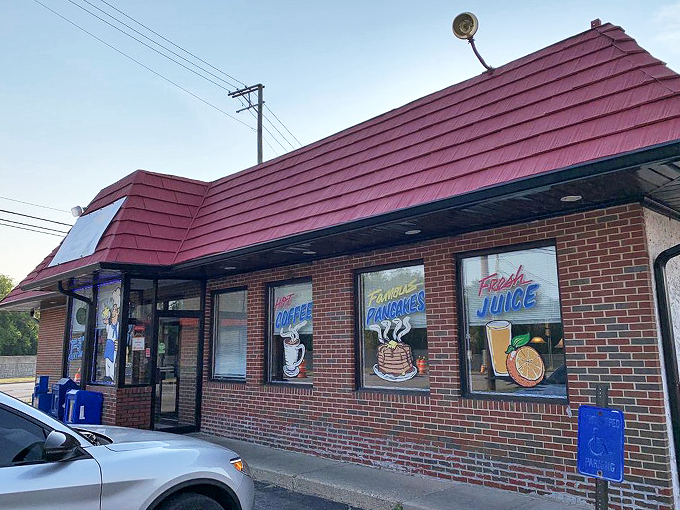A humble facade with a big promise: hot coffee, famous pancakes, and fresh juice. This unassuming diner might just be your new favorite breakfast spot!