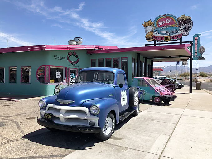 A turquoise time capsule with vintage wheels parked outside &ndash; Mr. D'z exterior screams "the 1950s called and left something wonderful!"